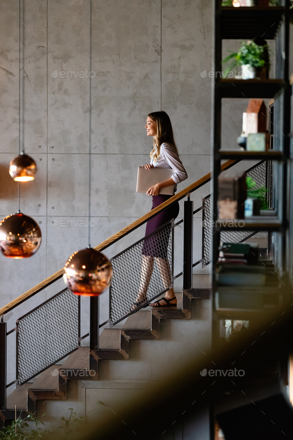 Portrait of a young confident business woman in office Stock Photo by ...