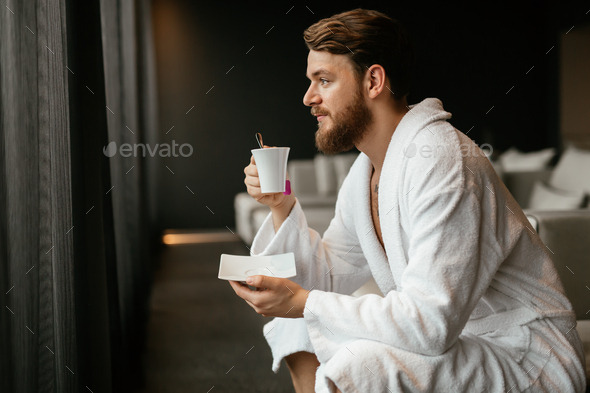 Handsome man drinking tea Stock Photo by nd3000 | PhotoDune