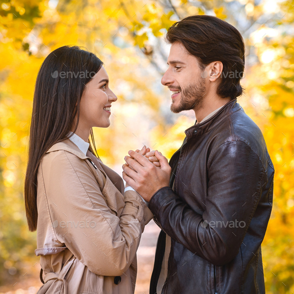 Man in love confessing his feelings to girlfriend, holding hands Stock ...