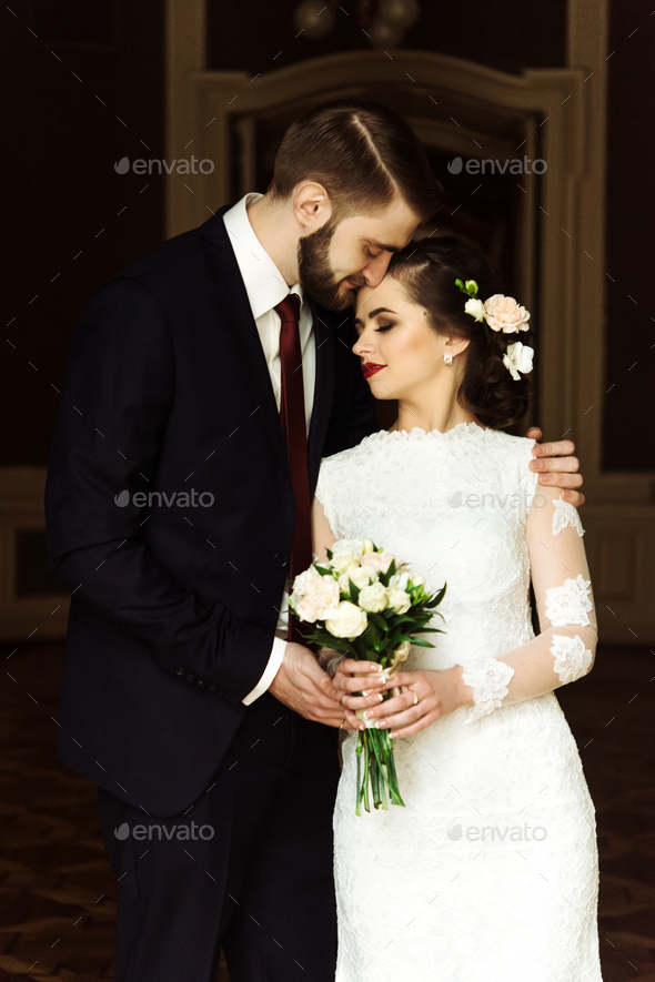 stylish luxury bride and handsome elegant groom hugging Stock Photo by ...