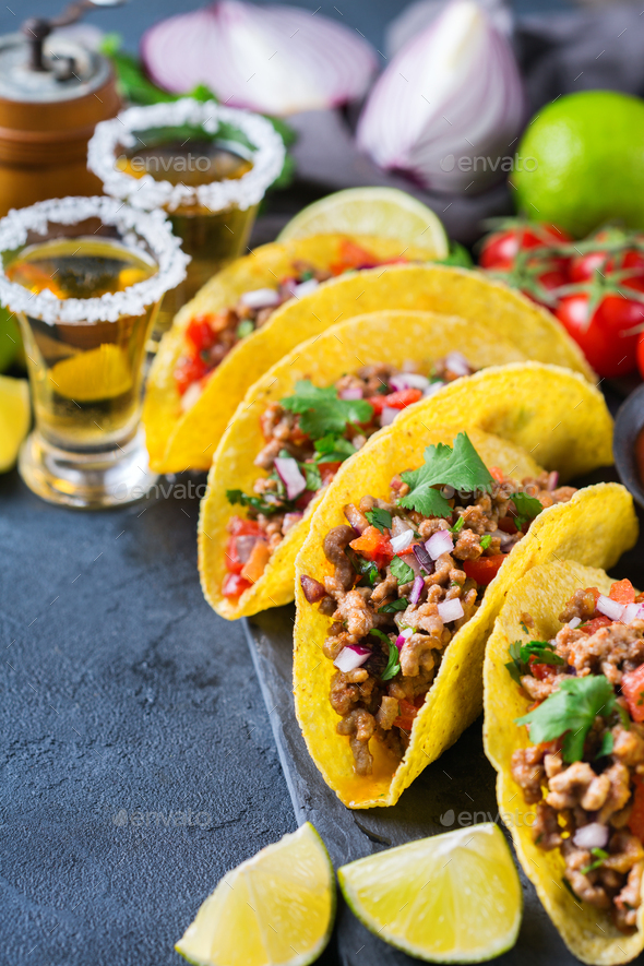 Taco shell nachos with beef, guacamole, chili, cheese salsa, tequila ...