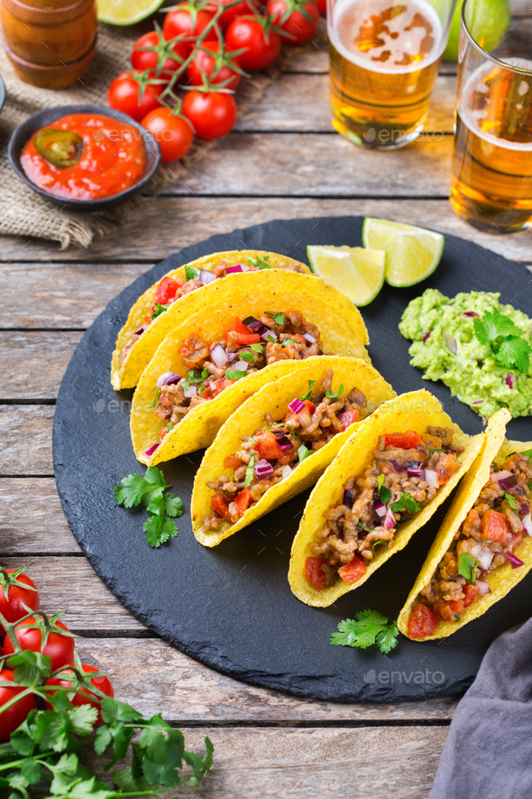 Taco shell nachos with beef, guacamole, chili, cheese salsa, tequila ...