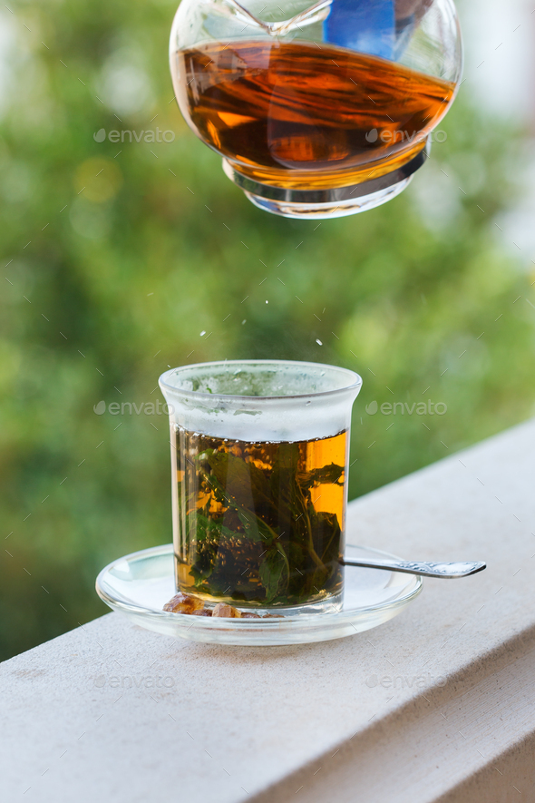 Glass of hot mint tea, traditional moroccan moorish beverage Stock ...