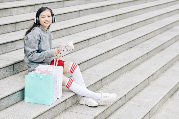 Teenage girl sitting on steps Stock Photo by DragonImages | PhotoDune