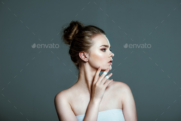 young beautiful tender girl posing with creative white body art line on ...