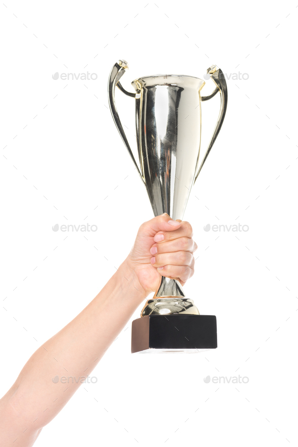 partial view of female hand holding champion cup isolated on white ...
