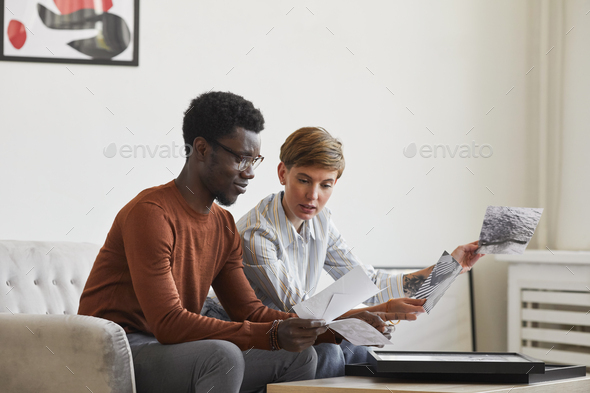 Two Art Experts Discussing Paintings in Gallery Stock Photo by ...