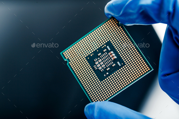 Semiconductor microchip in gloved hand Stock Photo by Vladdeep | PhotoDune