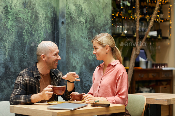 Couple drinking coffee in cafe Stock Photo by AnnaStills | PhotoDune