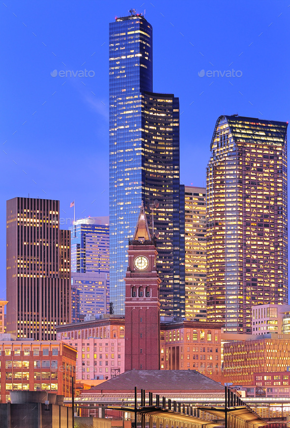 Clock tower and illuminated high rise buildings in Seattle city skyline ...