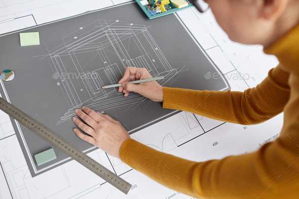 Female Engineer Drawing Plans Stock Photo by seventyfourimages | PhotoDune