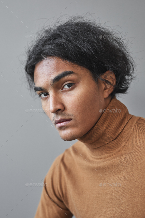 Mixed-Race Young Man on Grey Stock Photo by seventyfourimages | PhotoDune