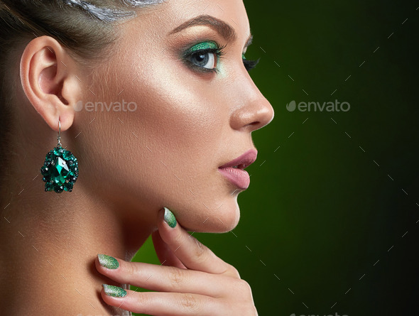 Back view of girl with green shiny makeup and manicure. Stock Photo by ...