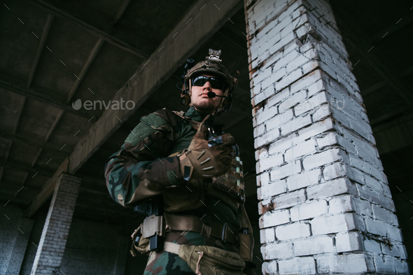 Military men with arms defending the building. Soldier stand guard ...