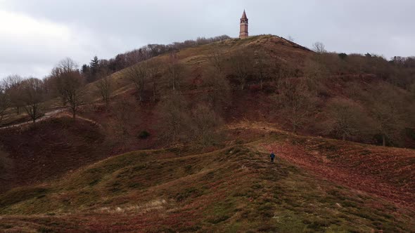 Aerial of a Tourist Hiking Along the Hills in Himmelbjerget Area ...