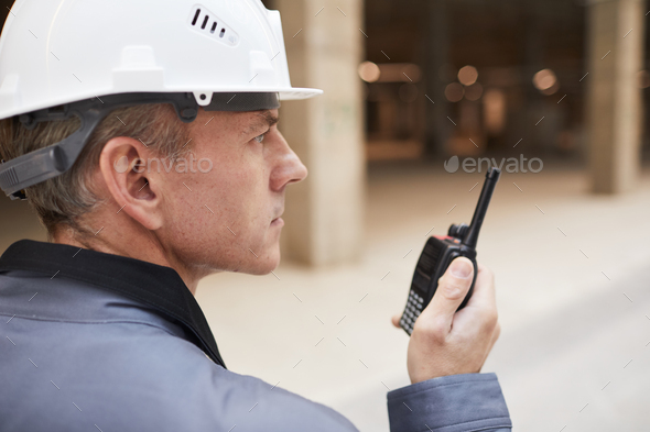 Construction Worker Speaking by Portable Radio Stock Photo by ...