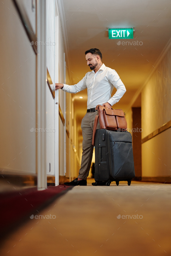 Hotel guest entering room Stock Photo by DragonImages | PhotoDune