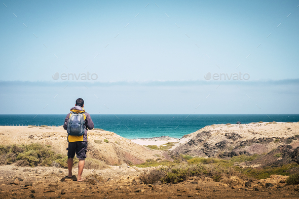 Back view of standing backpacker man Stock Photo by simonapilolla ...