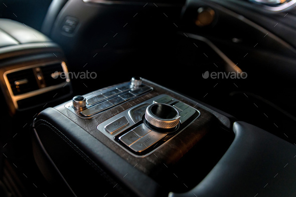 Modern luxury car central console for rear passengers Stock Photo by ...
