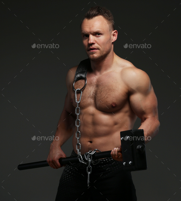 Muscular guy holding hummer Stock Photo by fxquadro | PhotoDune