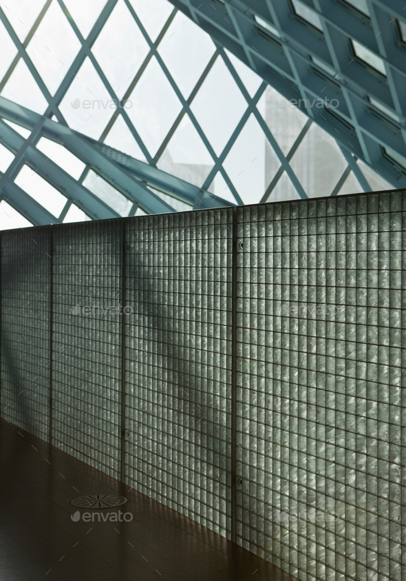 Building interior, sloping glass roof panels, barrier, fence with ...