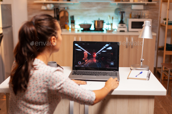 Female game developer working on new project Stock Photo by DC_Studio