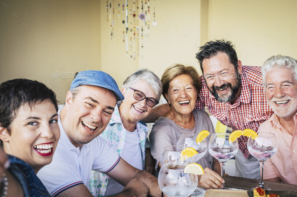 mixed ages group of caucasian people having fun together celebrating ...