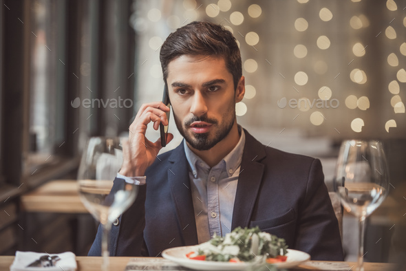 Handsome man in restaurant Stock Photo by GeorgeRudy | PhotoDune