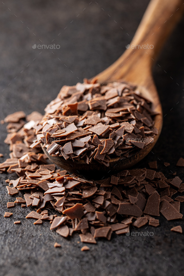 Grated dark chocolate. Chocolate flakes in wooden spoon. Stock Photo by ...