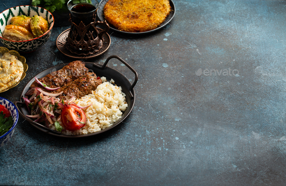 Traditional Turkish dish meat kebab with rice, vegetables with ...
