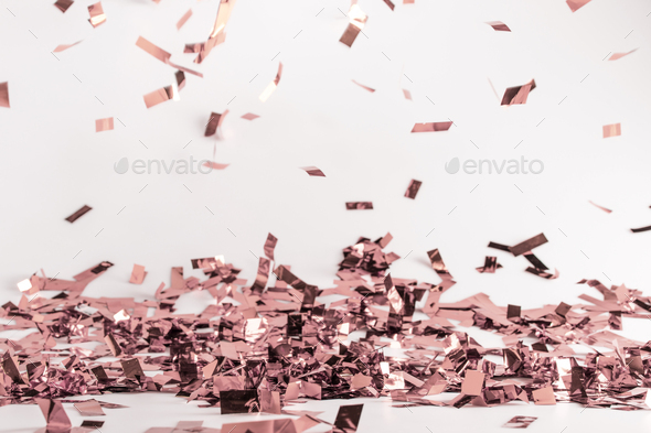 Muted pink falling confetti background Stock Photo by LightFieldStudios