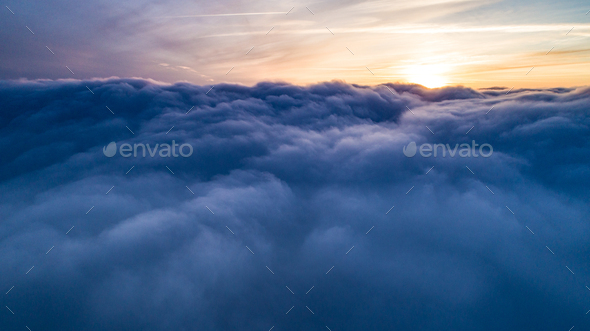 Magical view of cumulus clouds in winter at sunset Stock Photo by ...