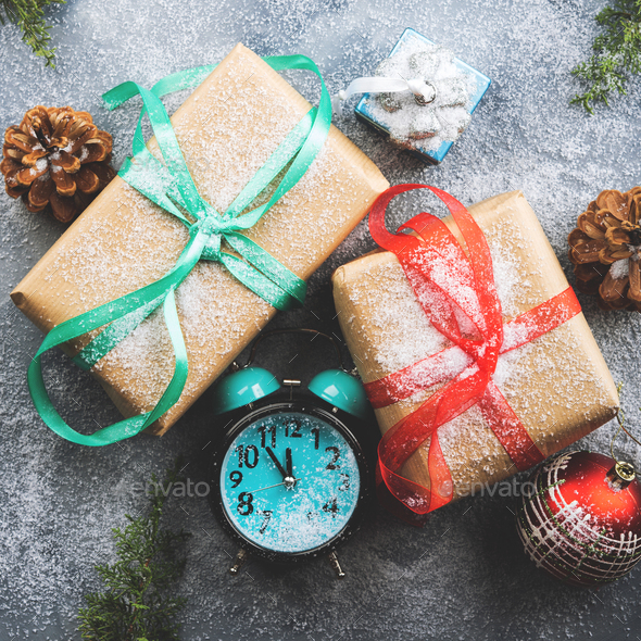 Christmas gifts with ribbons and snow. Clock Stock Photo by tenkende