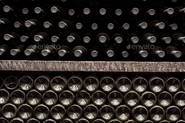 texture of wall made of wine bottles Stock Photo by LightFieldStudios