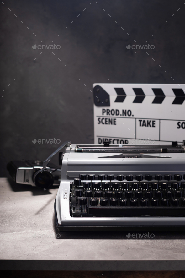 vintage typewriter, camera and movie clapper board Stock Photo by seregam