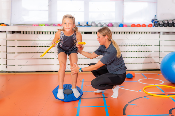Balance exercises for children, using balancing disks Stock Photo by ...