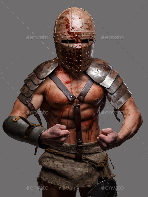 Wounded gladiator with muscular body in armour Stock Photo by fxquadro