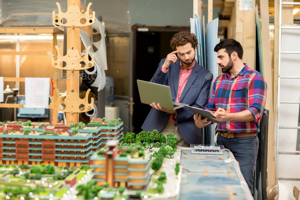 Architects consulting Stock Photo by Pressmaster | PhotoDune