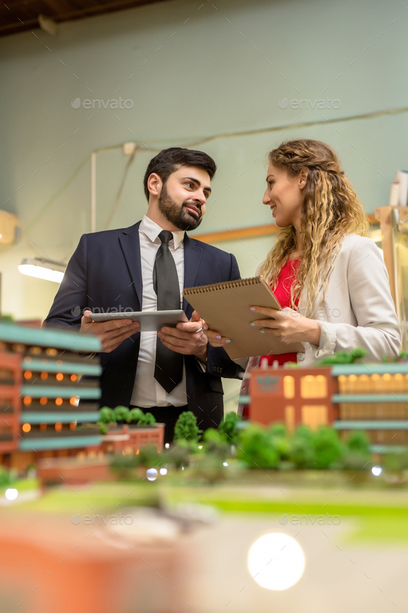 Designers talking Stock Photo by Pressmaster | PhotoDune