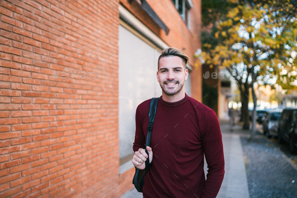 man walking on the street Stock Photo by megostudio | PhotoDune