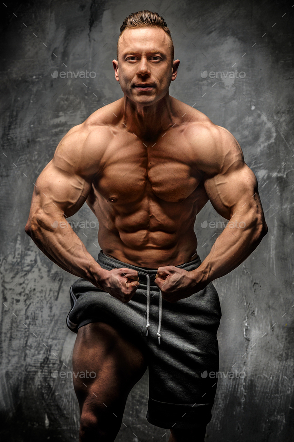 Bodybuilders posing in studio Stock Photo by fxquadro | PhotoDune