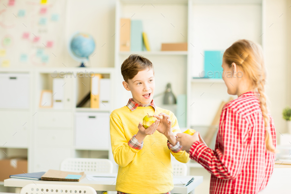 Conversation of classmates Stock Photo by Pressmaster | PhotoDune
