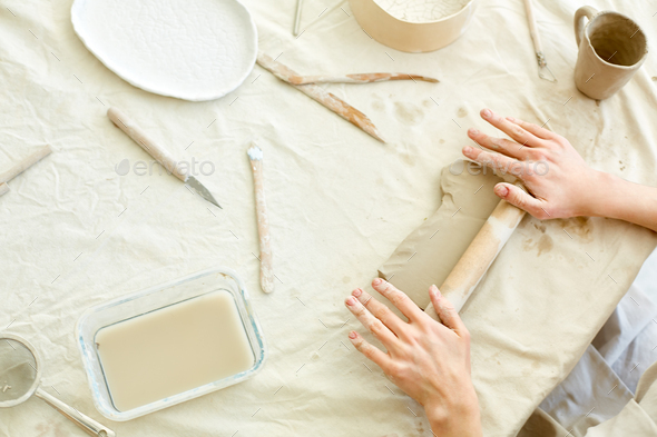 Rolling clay Stock Photo by Pressmaster | PhotoDune