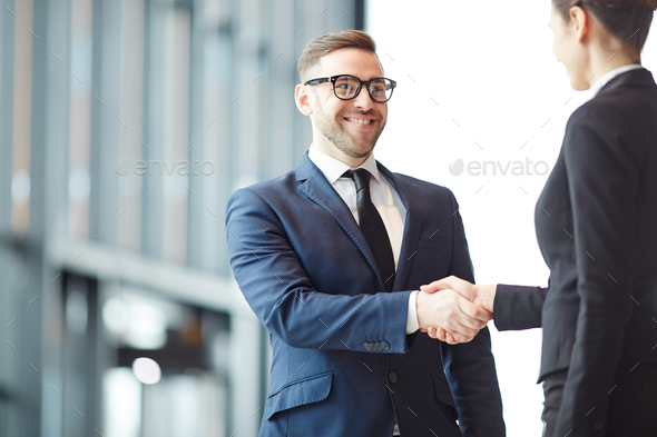 Greeting client Stock Photo by Pressmaster | PhotoDune