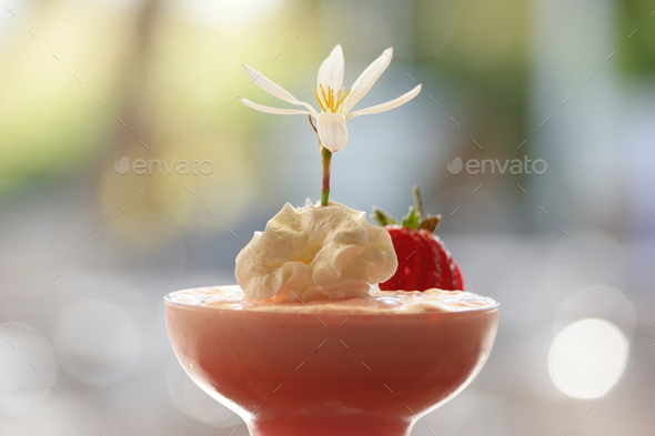 Creamy strawberry milkshake decorated with fresh flower. Stock Photo by ...