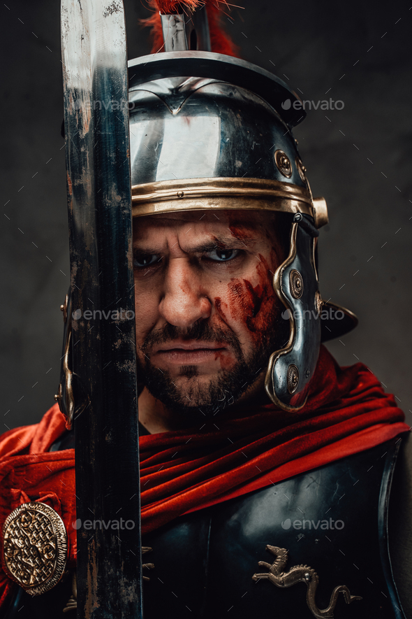 Angry greece warrior in armour holding his sword Stock Photo by fxquadro
