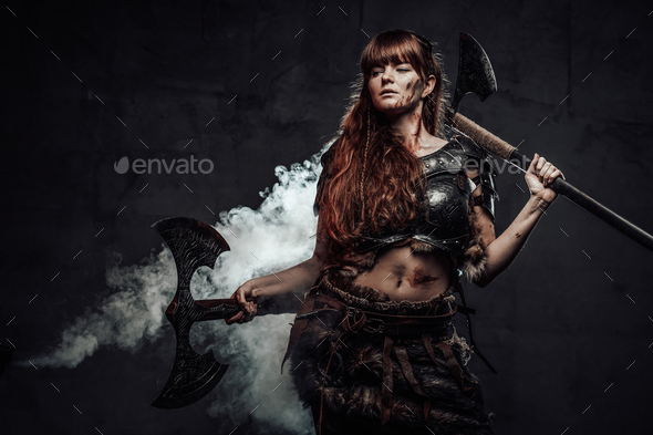 Beautiful female fighter from nord with two axes in smoke Stock Photo ...