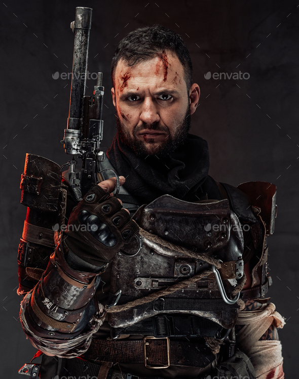 Serious apocalyptic fighter in ragged armour with pistol Stock Photo by ...