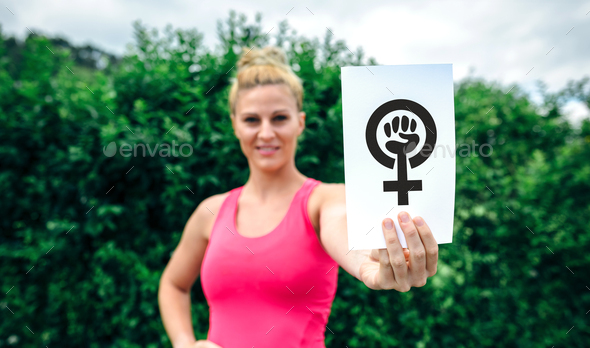 Woman showing symbol of feminism Stock Photo by davidpereiras | PhotoDune
