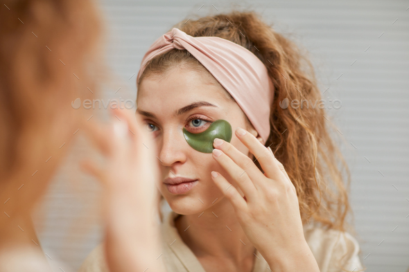 Woman applying patches Stock Photo by AnnaStills | PhotoDune